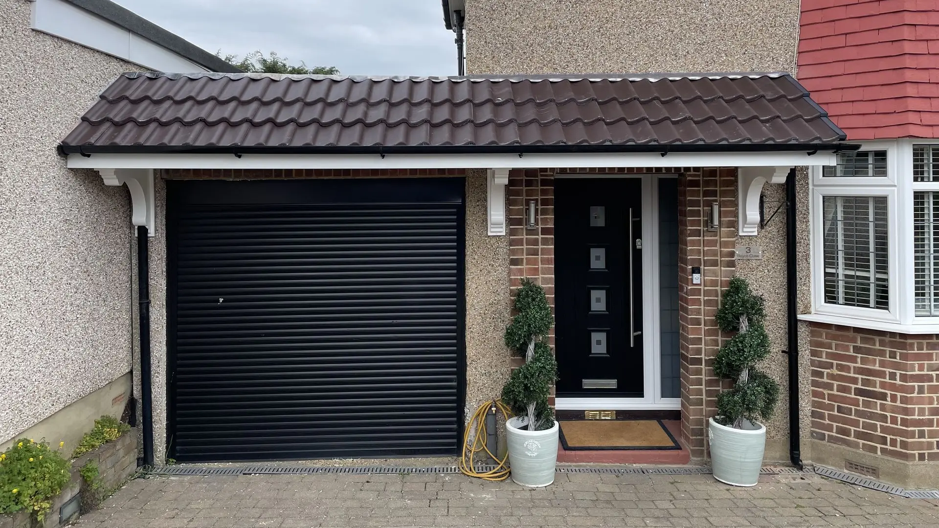 Transforming Home Exteriors: A Unique Tiled Door Canopy Installation O
